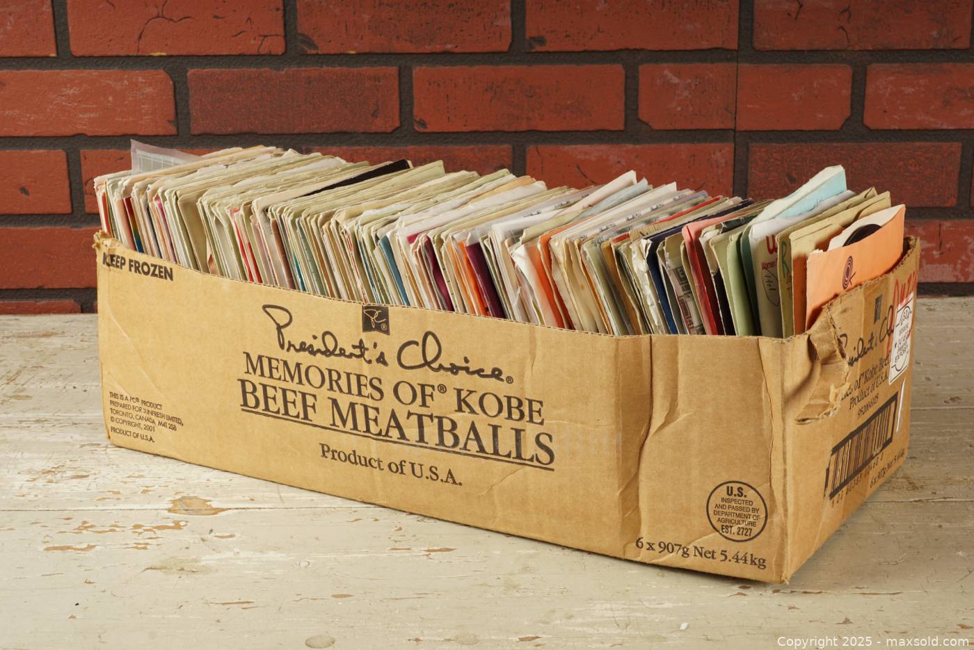 45 RPM RECORD BOX WITH APPROX. 200 RECORDS. Appears to be mostly rock ...