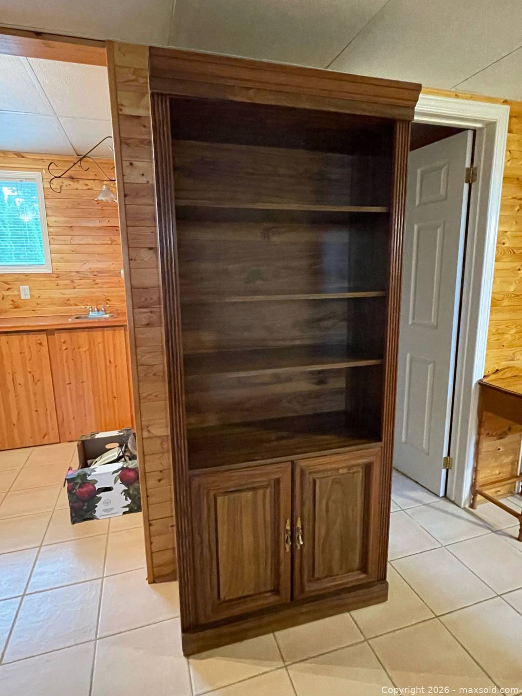 Tall Brown Wood-Veneer Bookcase with Lower Cabinet | Maxsold