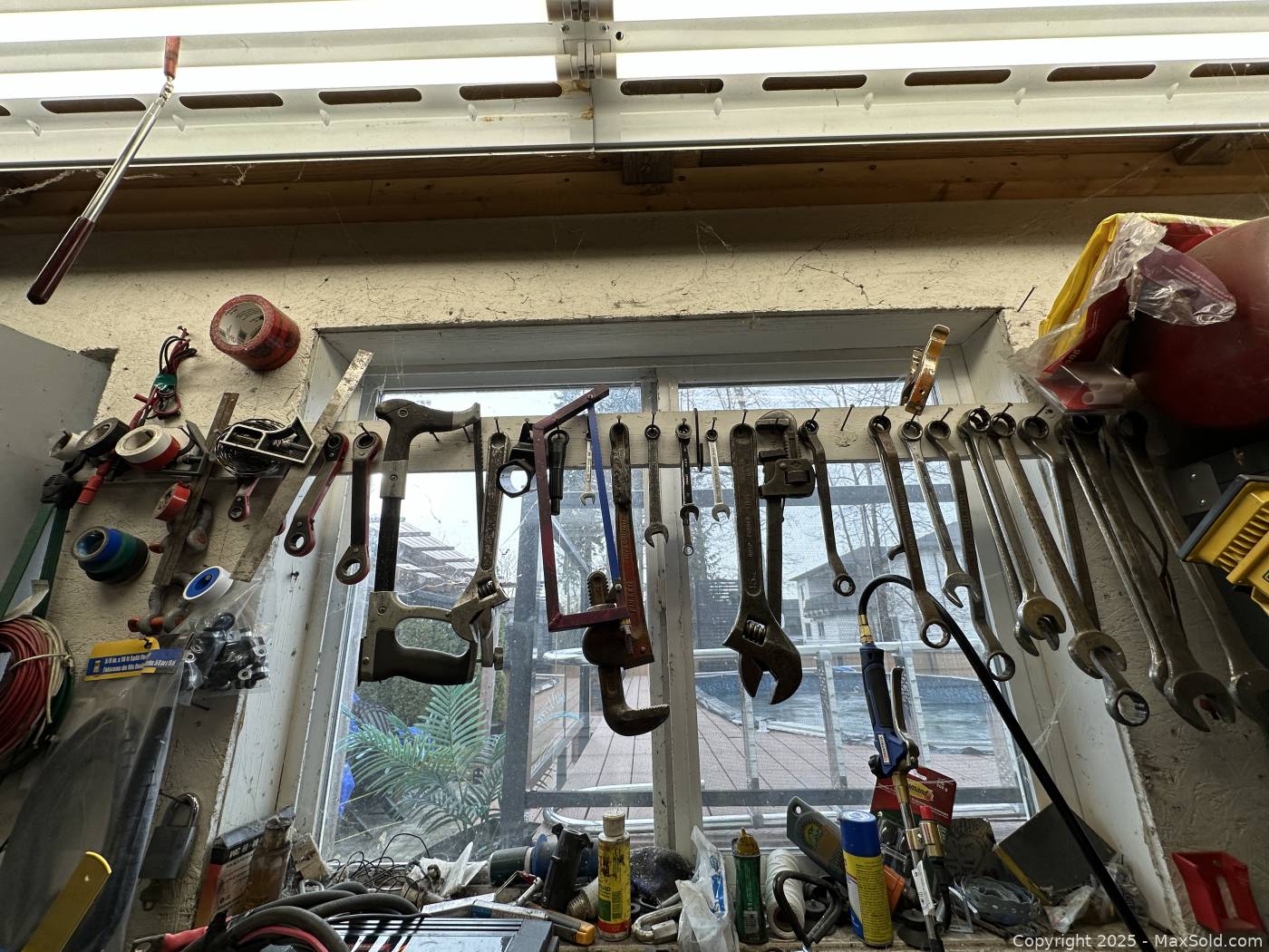 Misc Items hanging over window and incl items on the window ledge ...